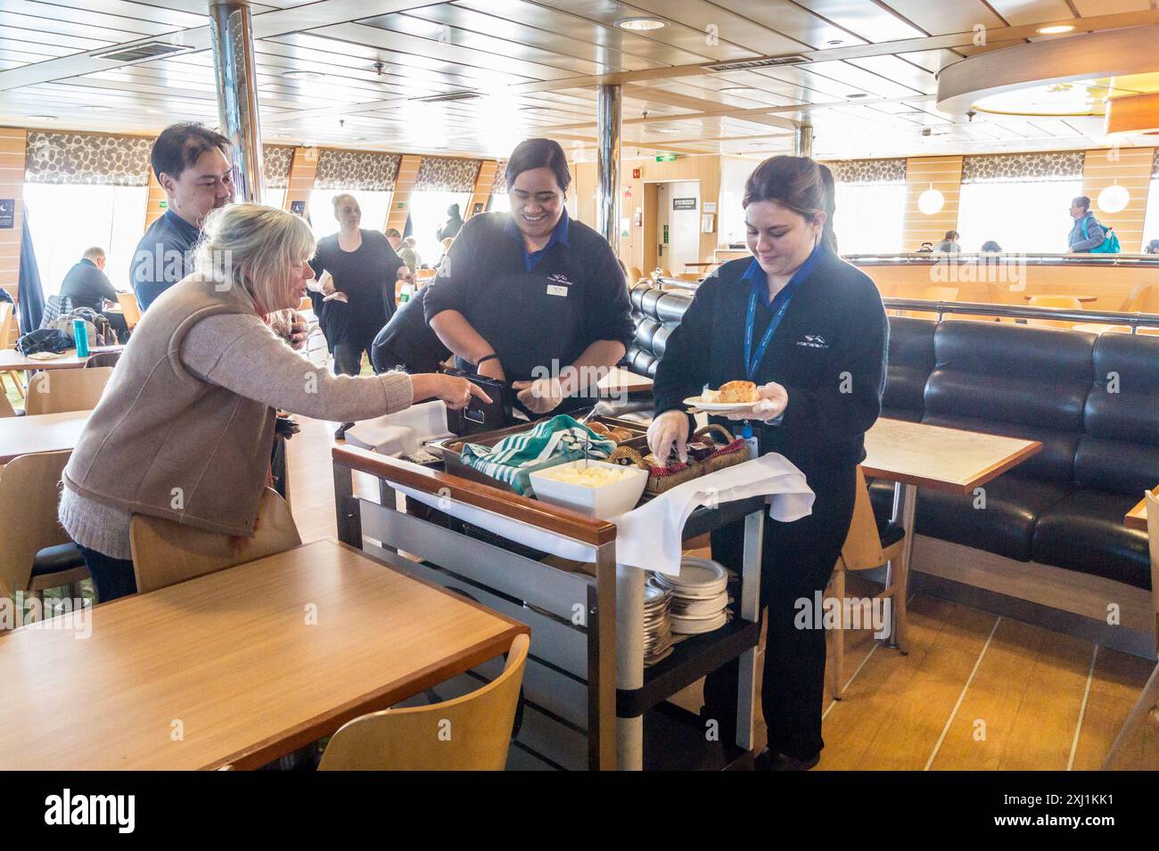 The crew serving freshly baked scones aboard the Interislander Cook ...