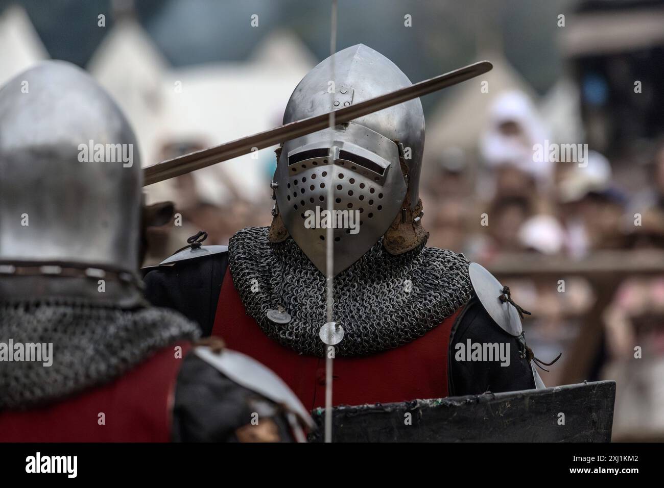 Medieval knights fight in a tournament with swords. Historical examples ...