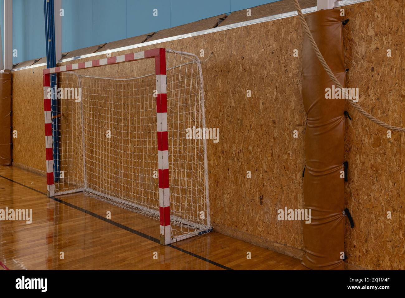 Indoor Sports Goalpost in Gymnasium with Wooden Wall, Red and White Net ...
