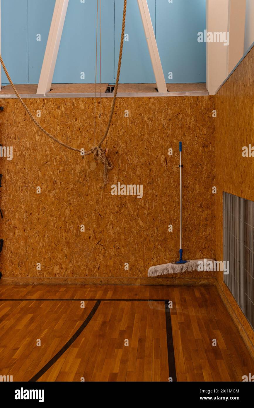 Indoor Gymnasium with Wooden Walls, Rope Climbing and mounted cleaning ...