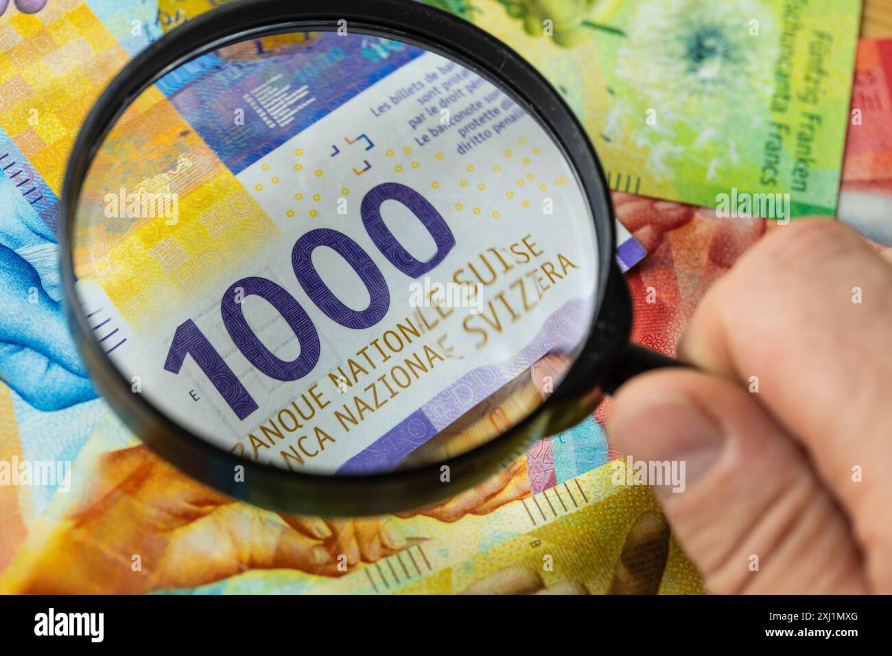 Swiss money, various denominations. Swiss franc under the microscope ...
