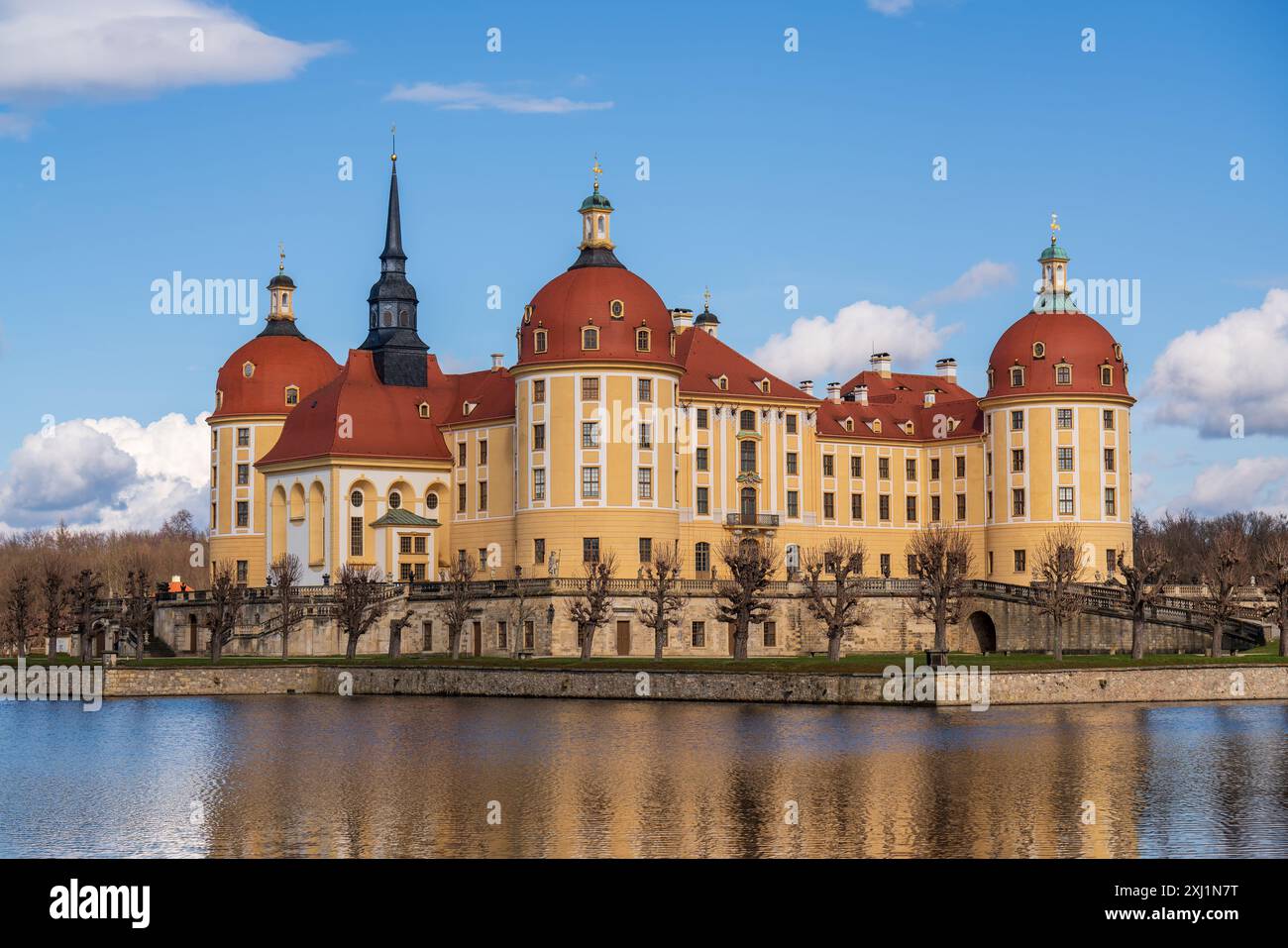 Moritzburg Castle, located on the lake, reflection of the lake in the ...