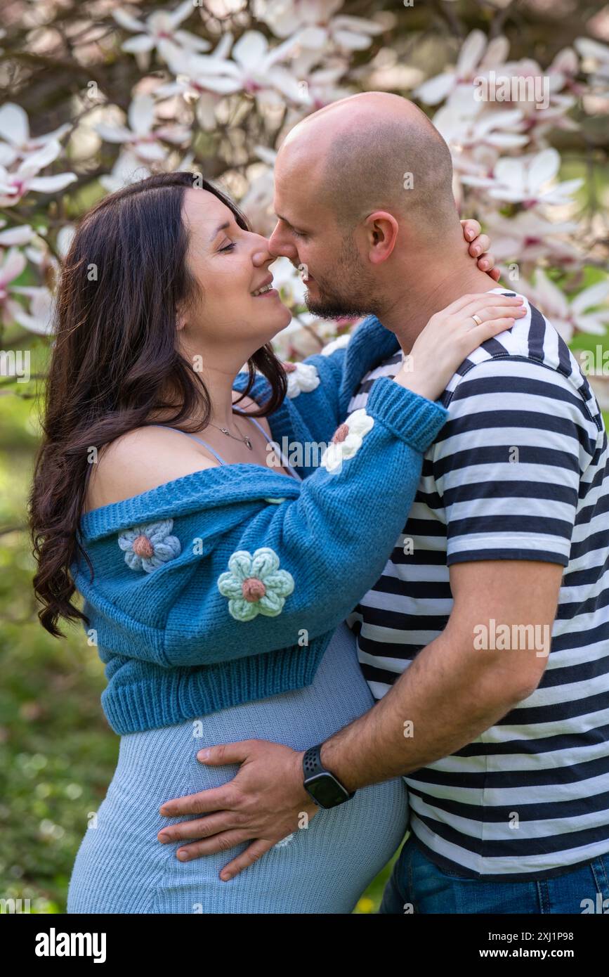 A happy family is expecting a baby and expresses their love for each ...