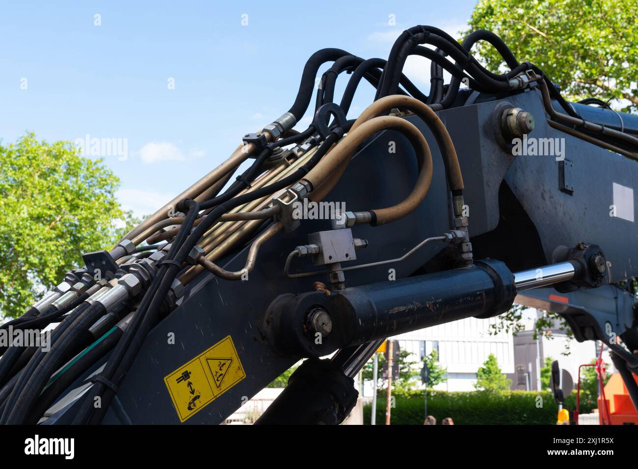 Close-up image showcases the complex hydraulic system of an excavator ...