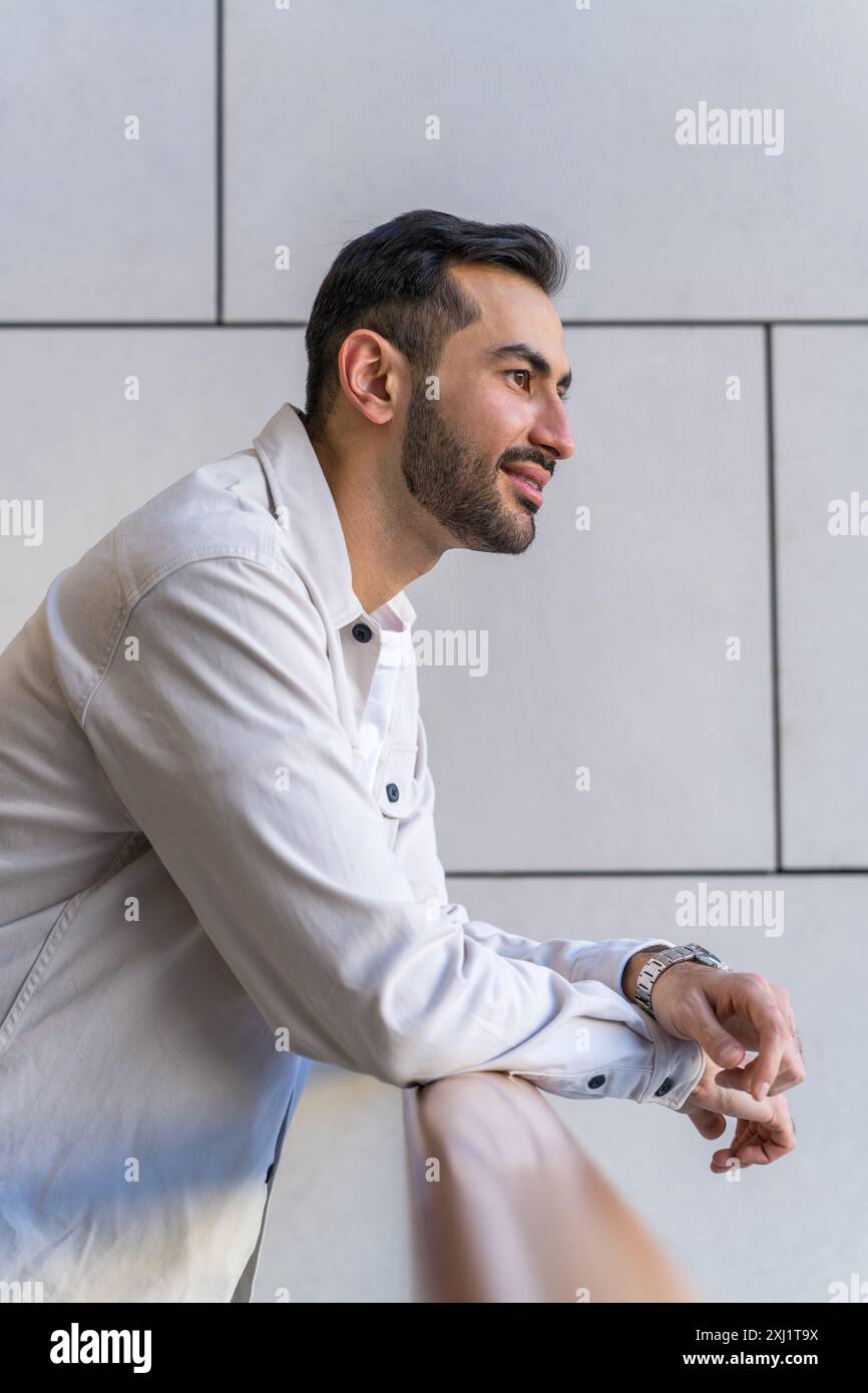 Portrait of a handsome young man. A smiling Asian man with a neat beard ...