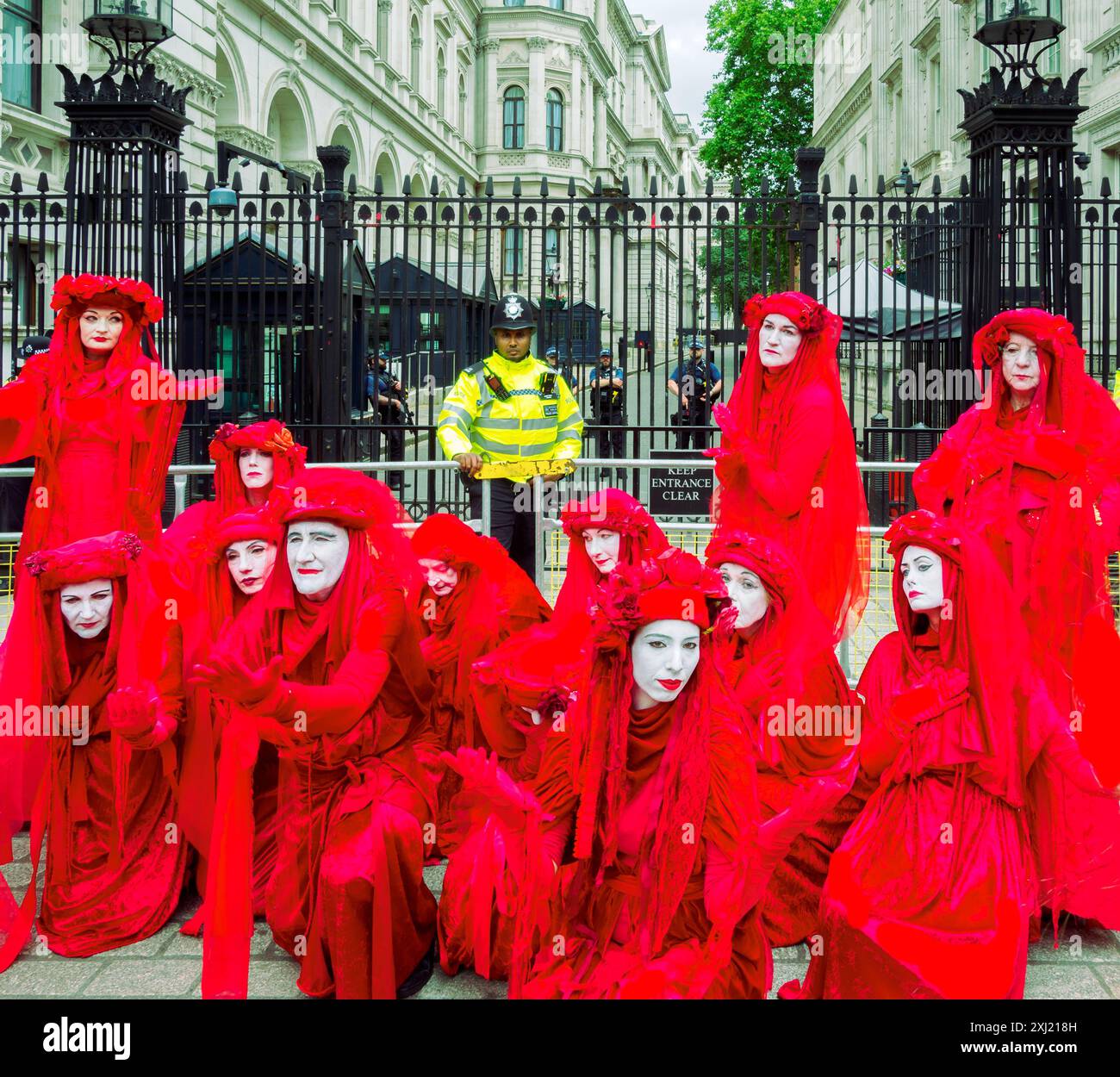 The Red Rebels Brigade of Extinction Rebellion at the gates of Downing ...