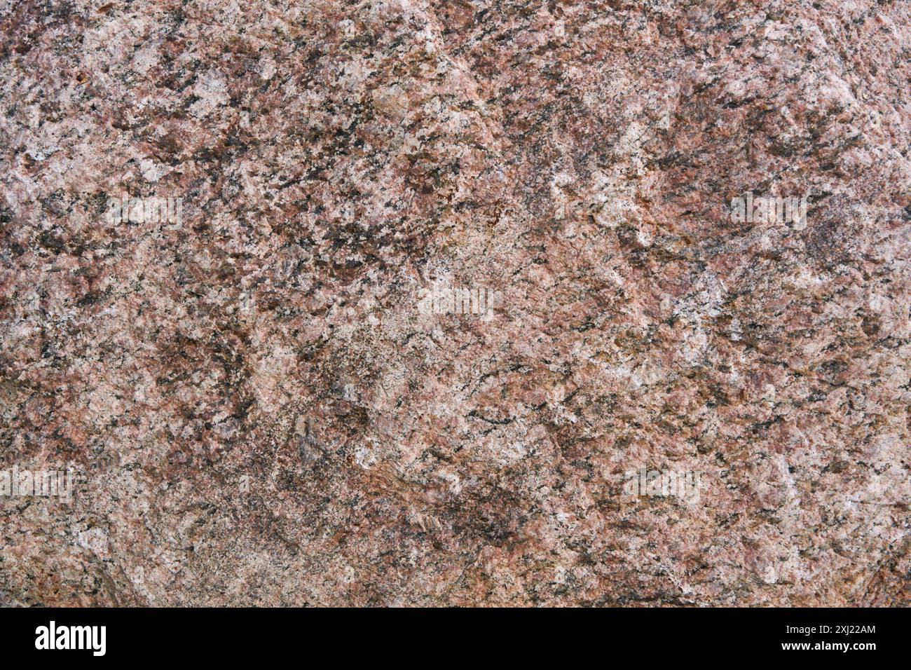 Large granite stone boulder texture background. Red granite old boulder ...