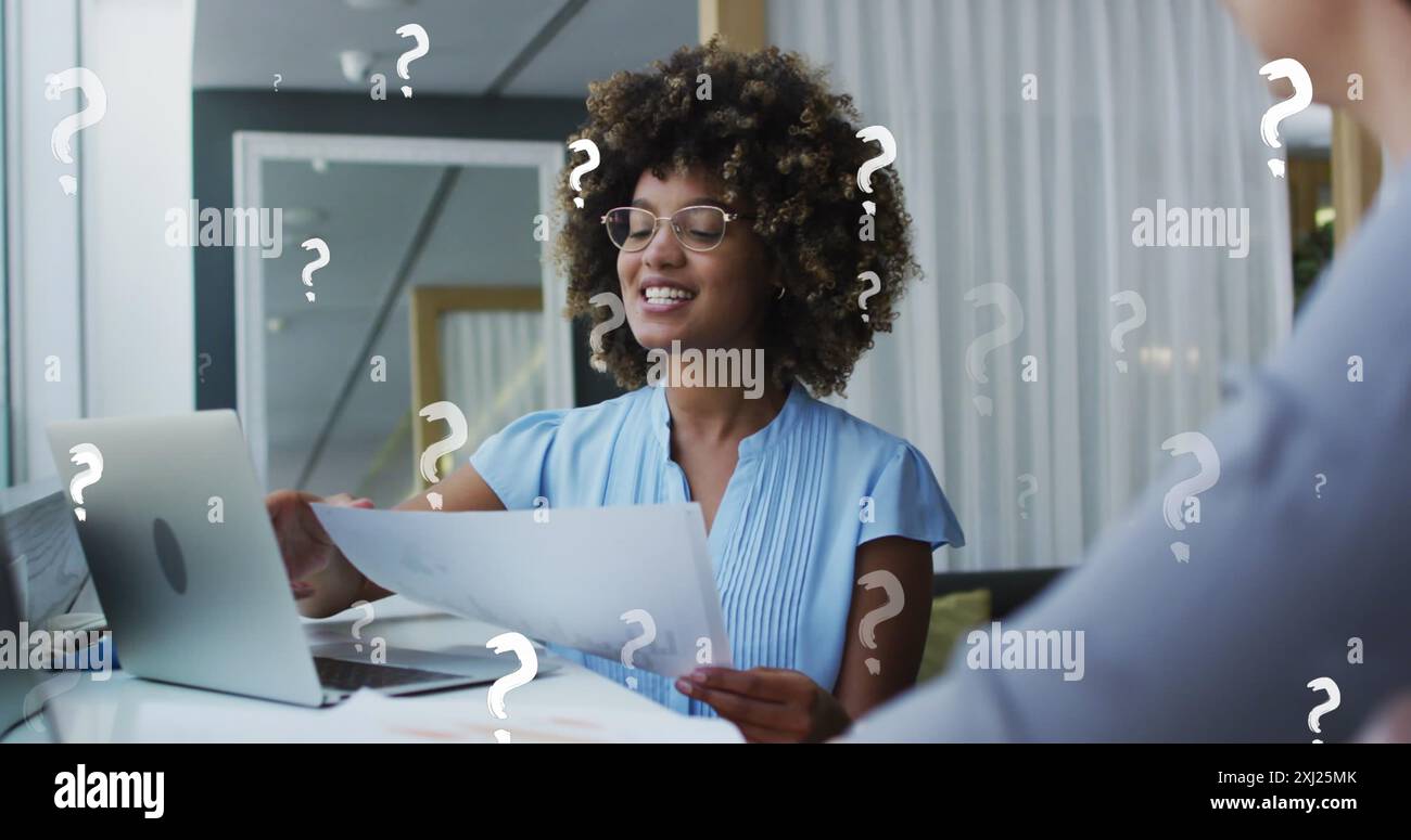 Image of question marks over diverse business people working at office ...