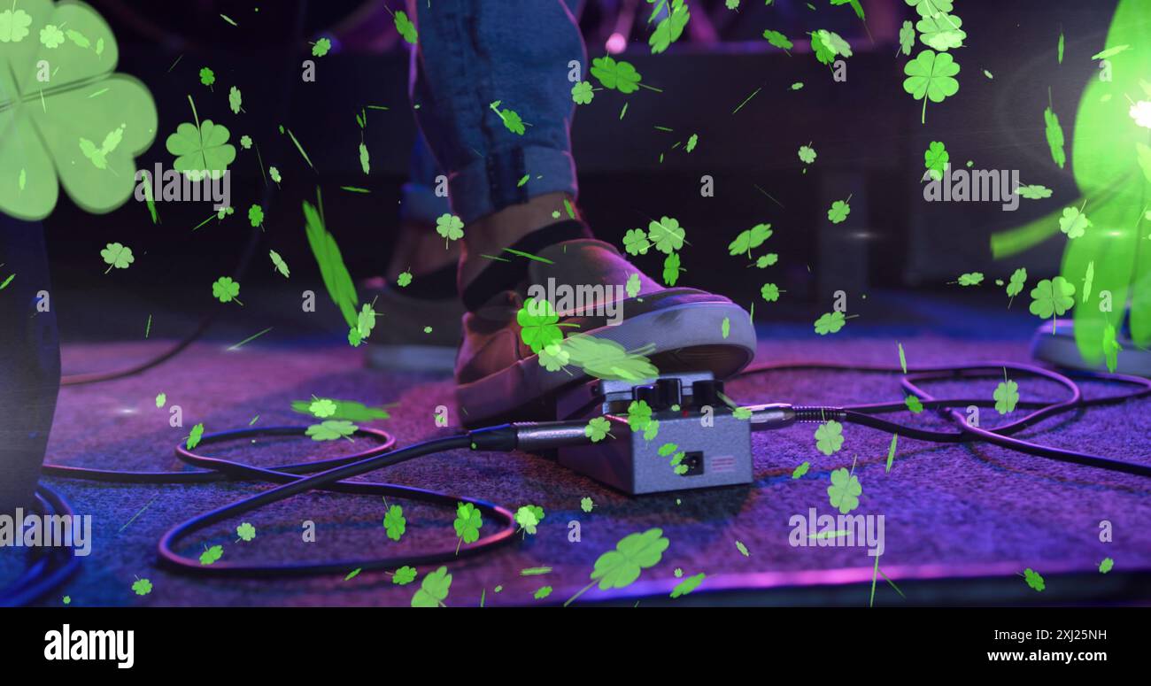 Image of st patrick's day green shamrock falling over man playing on ...