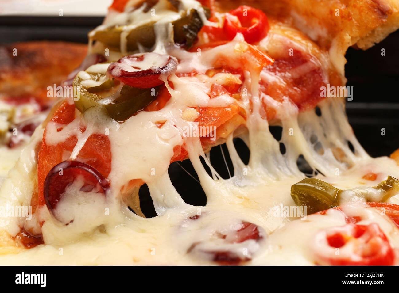 Taking piece of delicious pizza Diablo from baking tray, closeup Stock ...