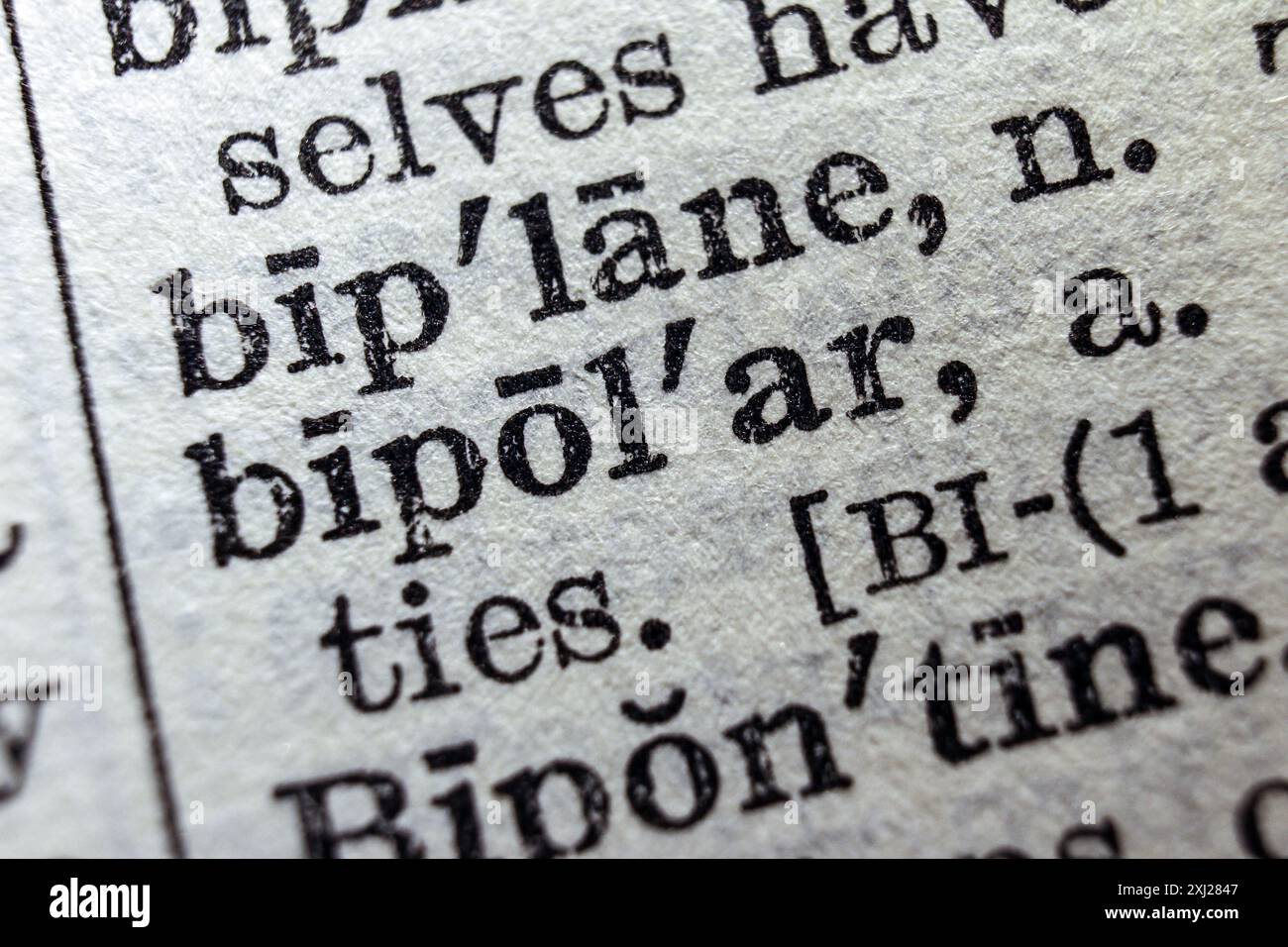 Word bipolar on dictionary page, macro close-up Stock Photo - Alamy