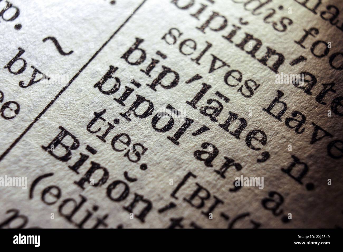 Word bipolar on dictionary page, macro close-up Stock Photo - Alamy