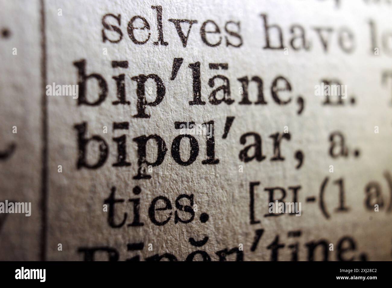 Word bipolar on dictionary page, macro close-up Stock Photo - Alamy