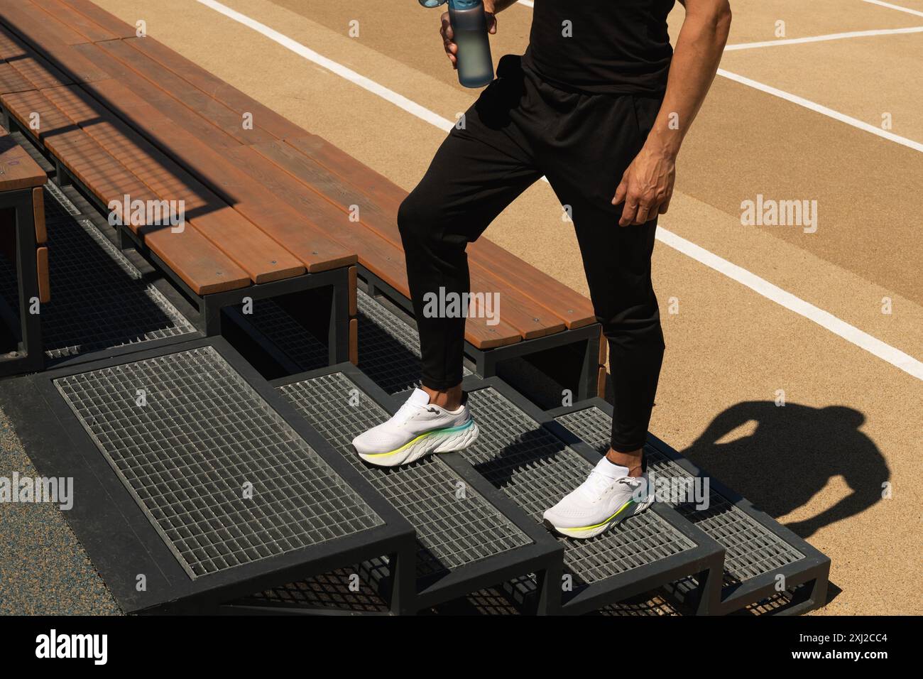 Athletes man legs on stair. sports ground. Outdoor workout. Copy space ...