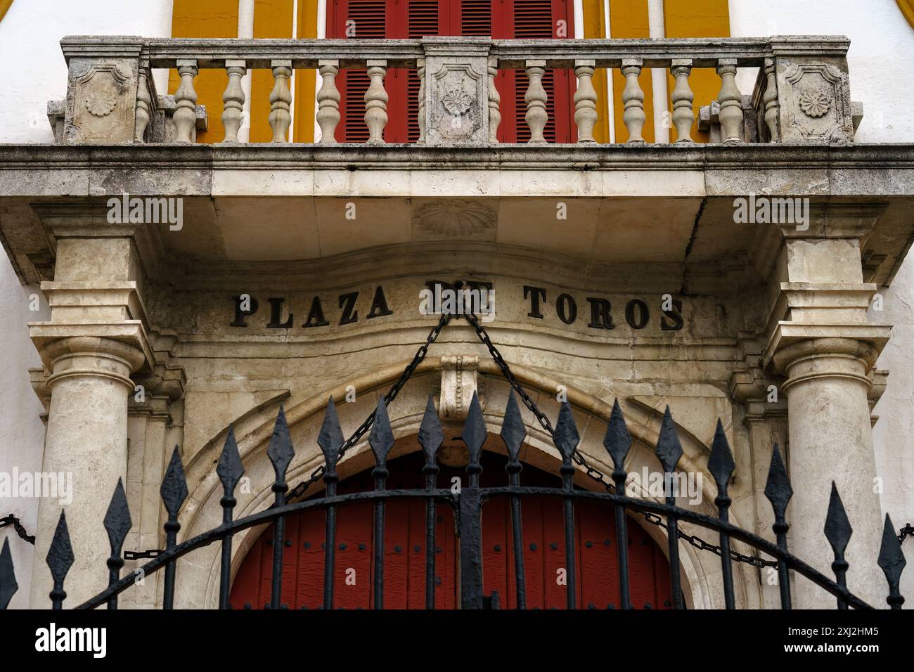 Seville, Spain. February 7, 2024 - Text above a historic door at Plaza ...