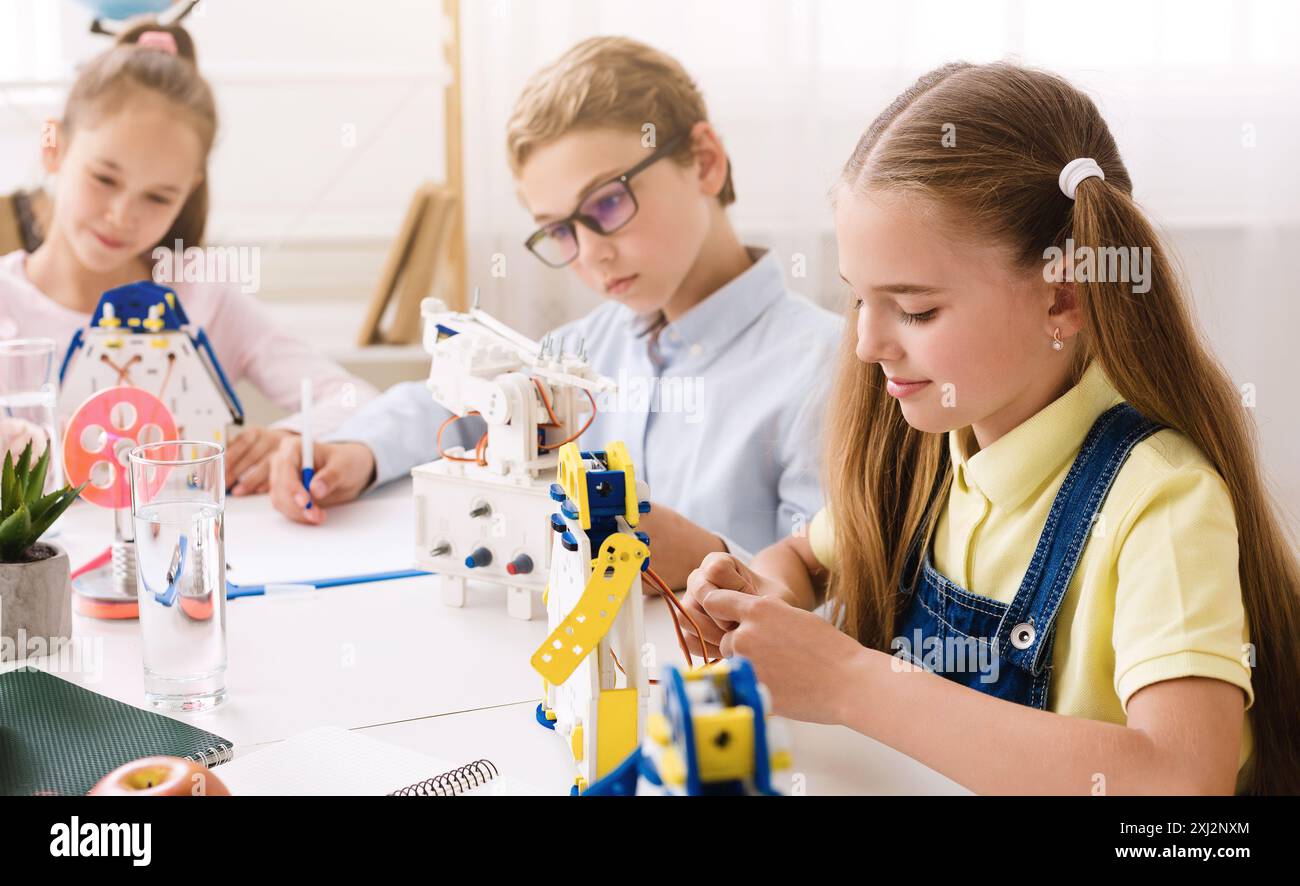Young Students Build Robots in Classroom Setting Stock Photo - Alamy