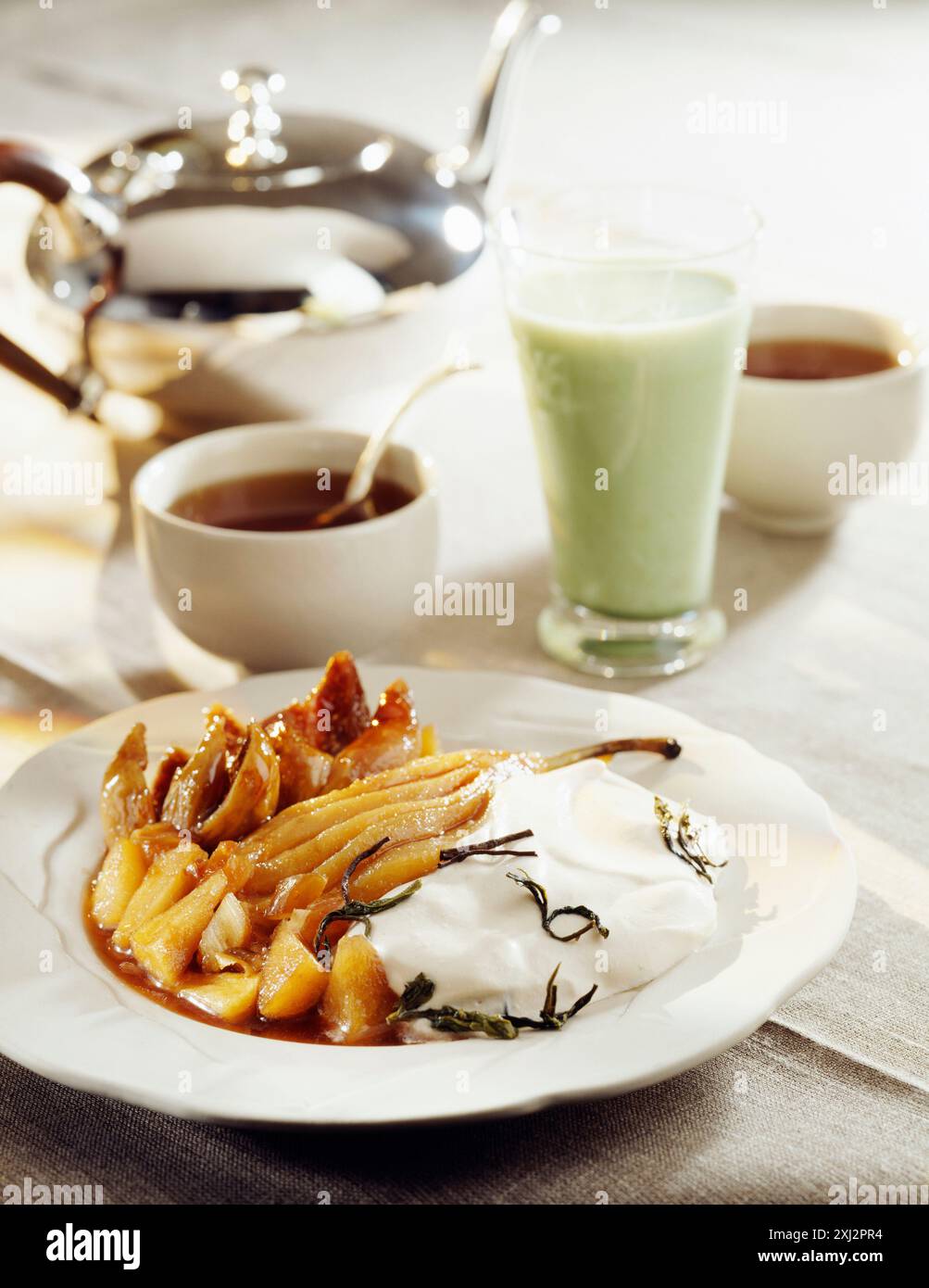 Pear compote with tea fromage blanc and green matcha tea drink Stock ...