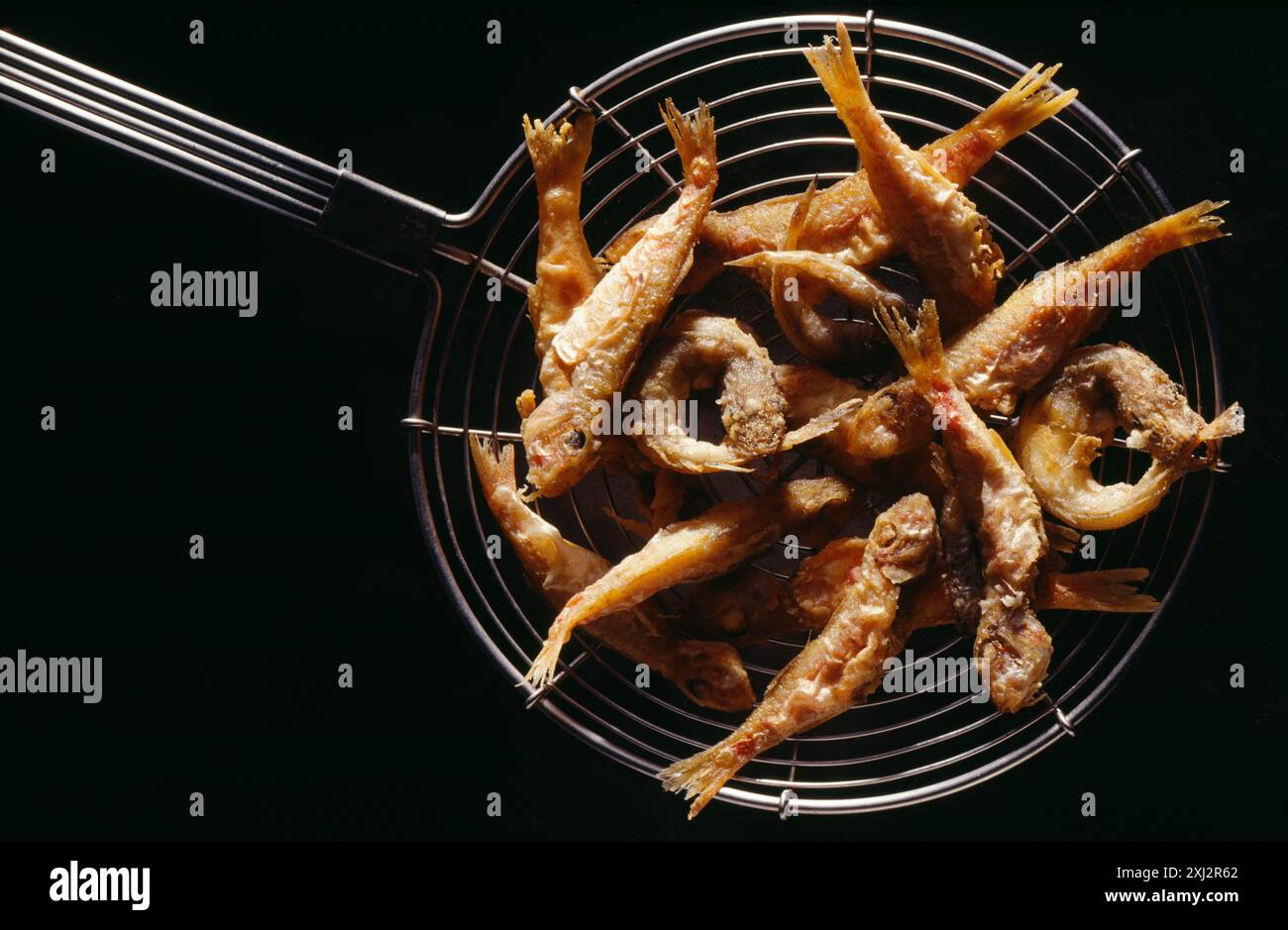 Deep fried small fish Stock Photo - Alamy