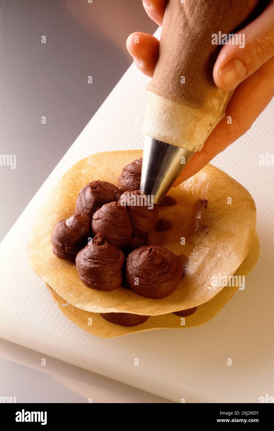 Adding the chocolate Stock Photo - Alamy