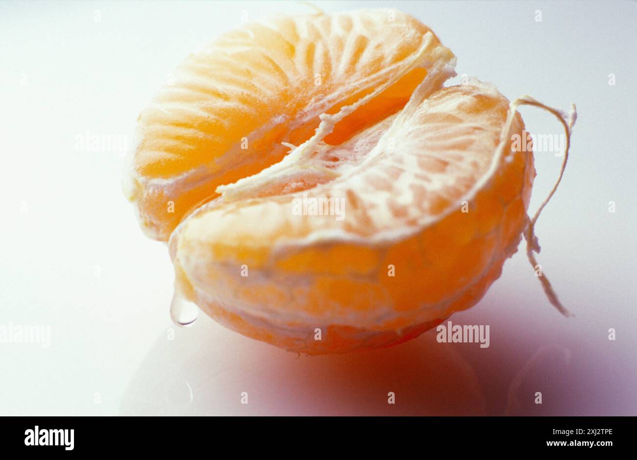 Half a clementine Stock Photo - Alamy