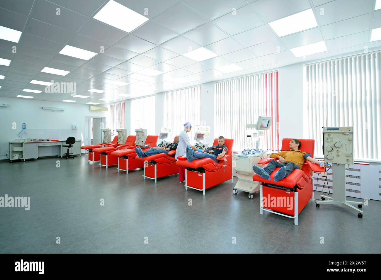 At the City (municipal) blood transfusion station. Nurse preparing ...