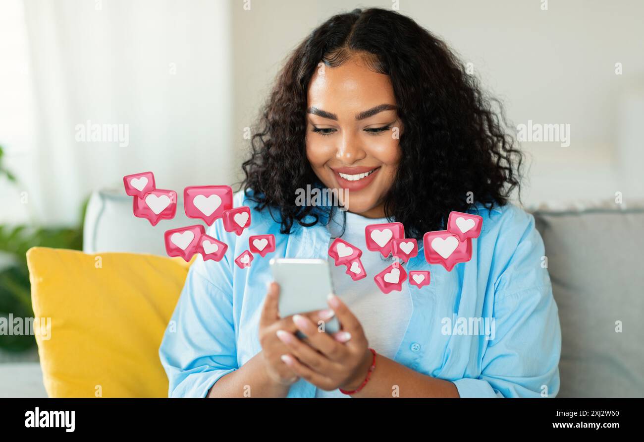 Woman Smiles While Checking Social Media on Her Phone Stock Photo - Alamy