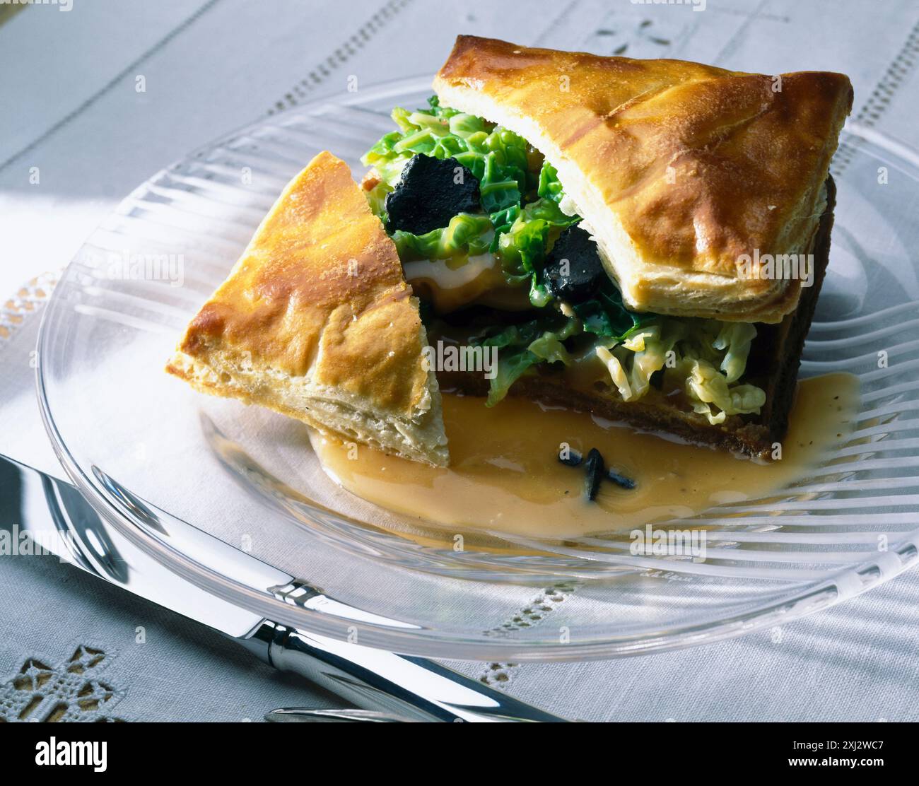 Individual cabbage puff pastry pie with Madere sauce Stock Photo - Alamy