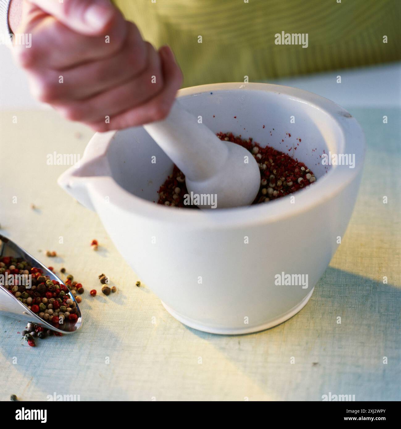Crushing spices in a mortar Stock Photo - Alamy
