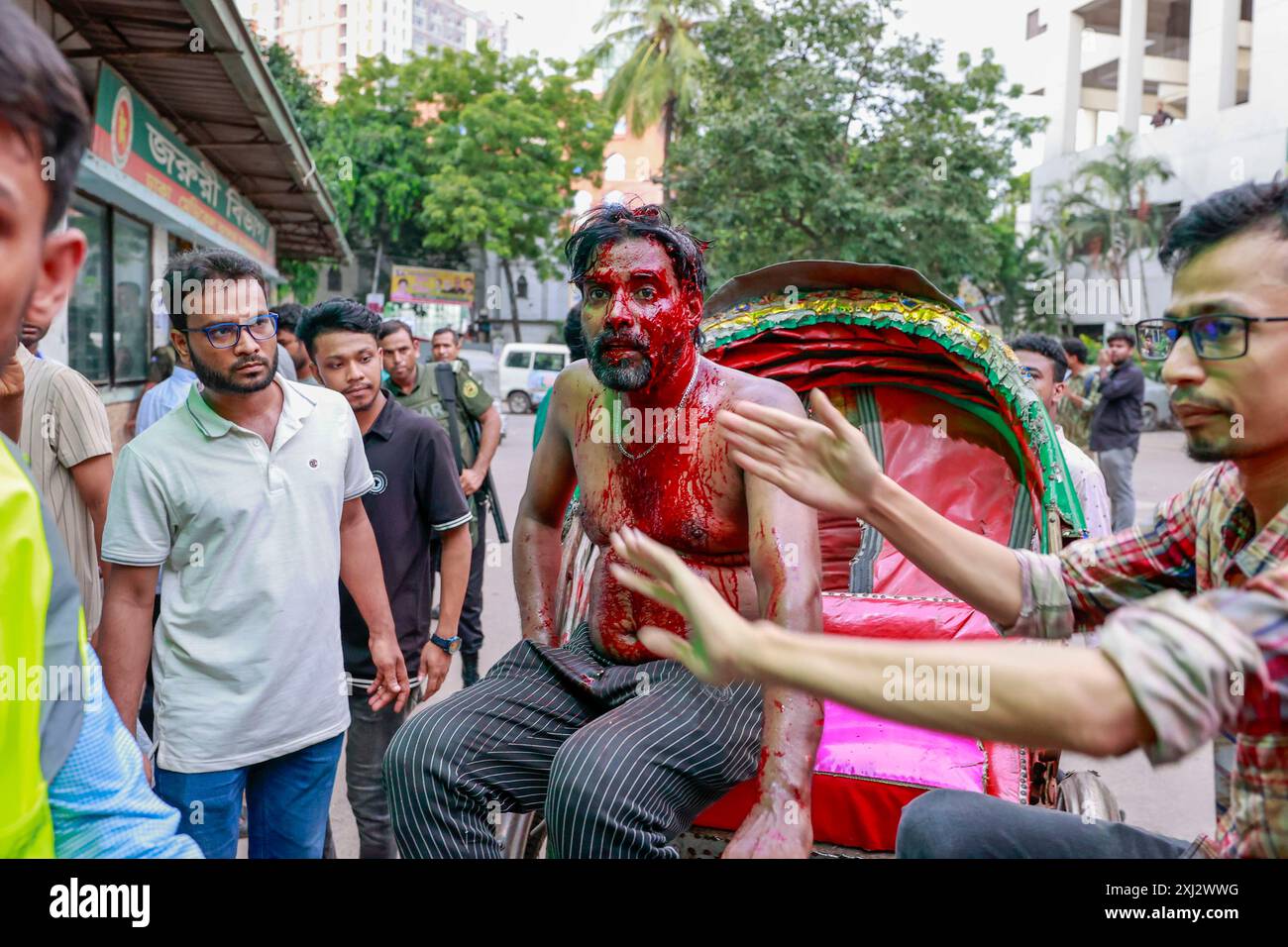 Dhaka, Bangladesh. 16th July, 2024. An injured person is assisted as ...