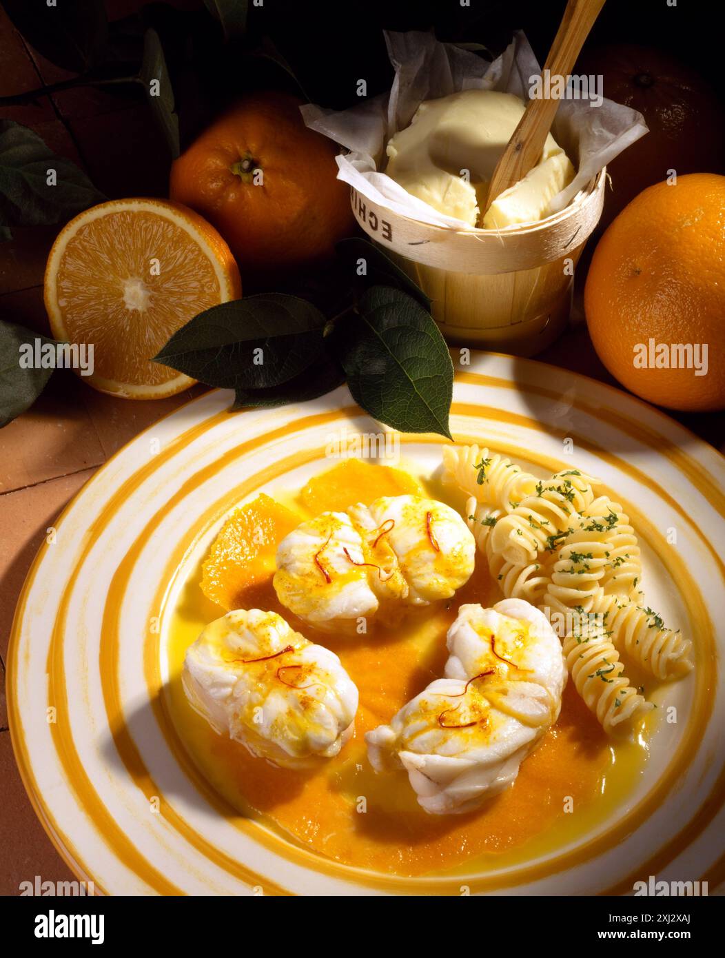 Monkfish with orange and saffron sauce Stock Photo - Alamy