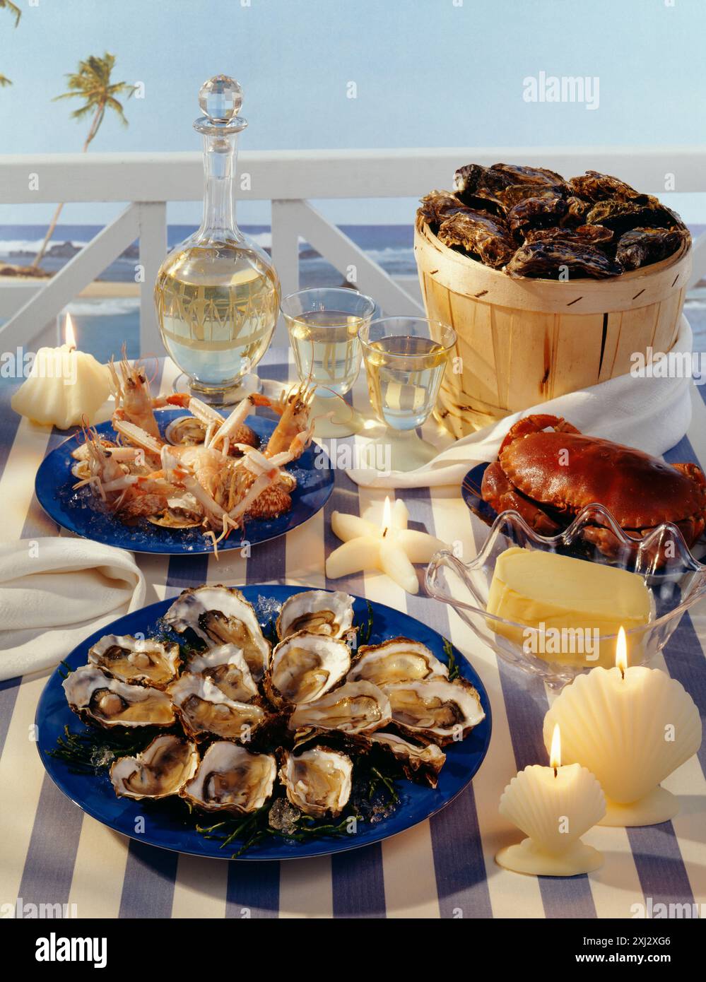 Assorted shellfish on a table on the seafront Stock Photo - Alamy