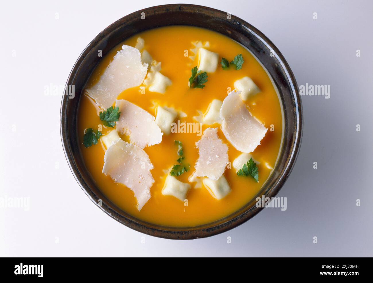 Pumpkin velouté with parmesan flakes Stock Photo - Alamy