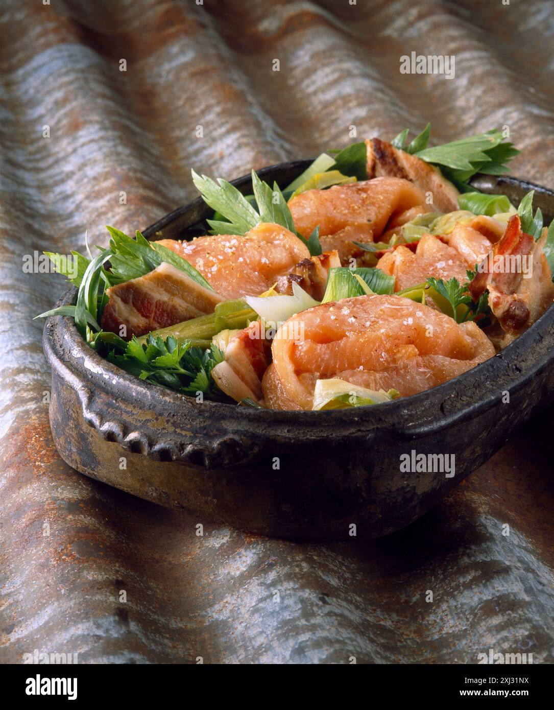 Oven-baked pink trout sillets with leeks and streaky bacon Stock Photo ...