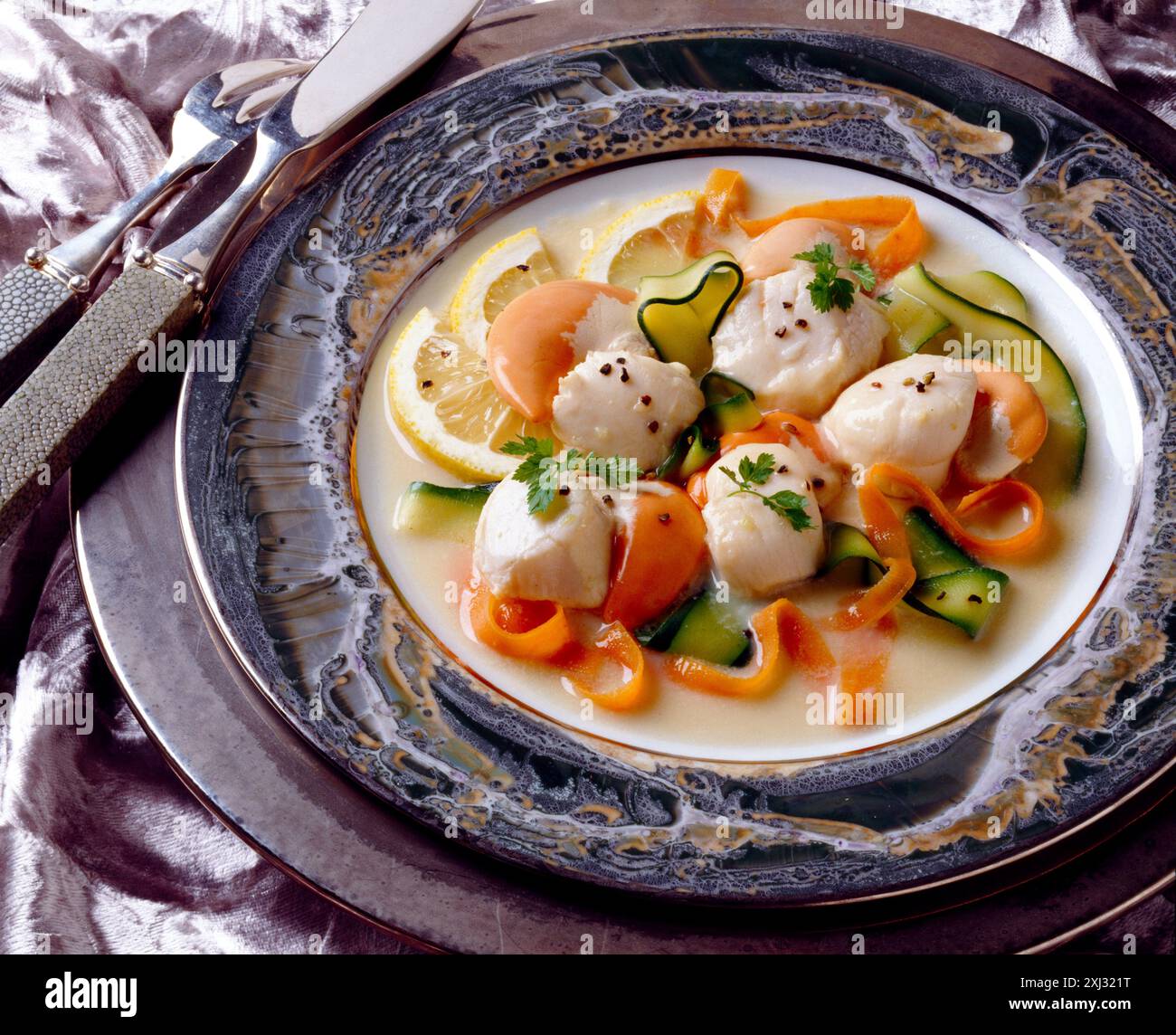 Scallop and vegetable Nage Stock Photo - Alamy