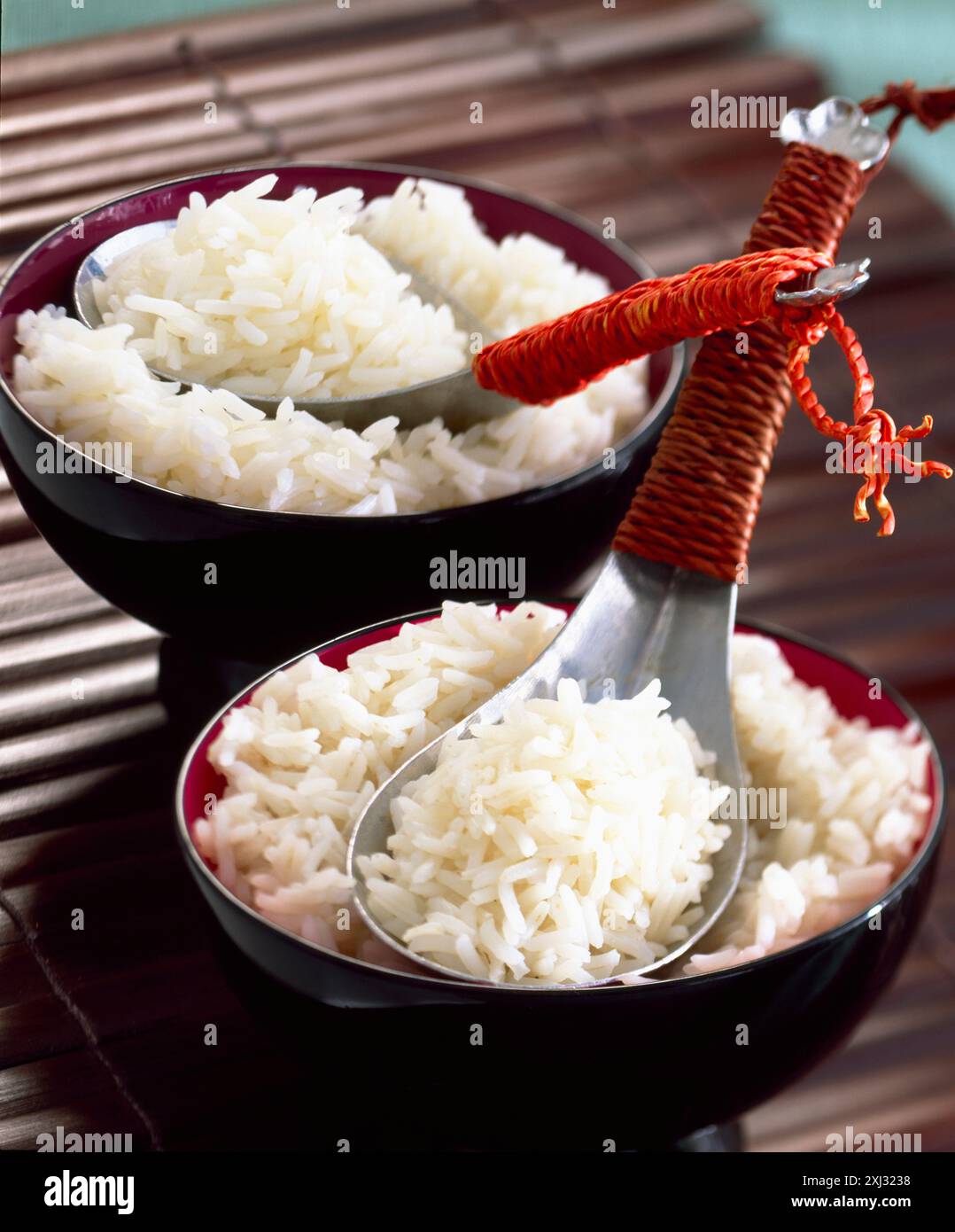 Bowls of cooked white rice Stock Photo - Alamy