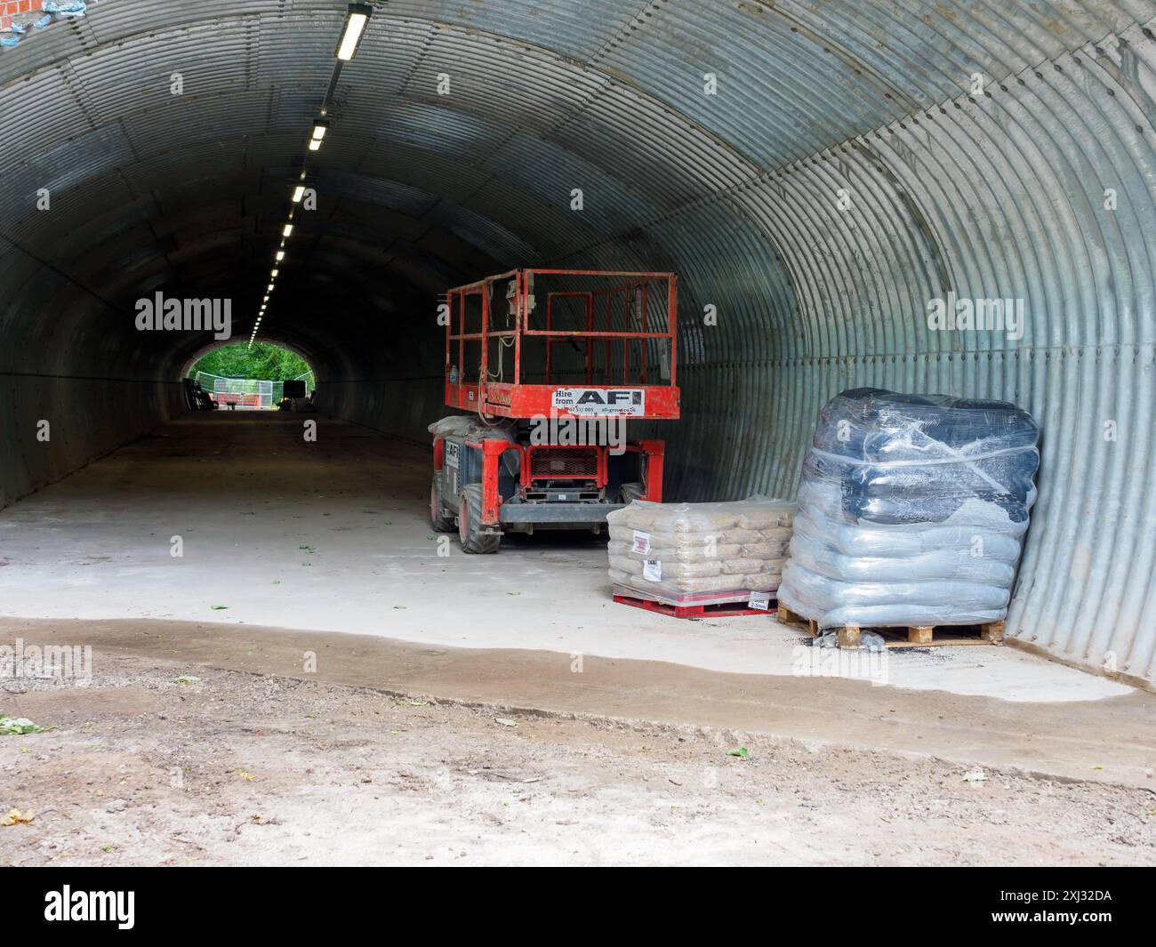 Industrial tunnel with construction equipment and materials set for ...