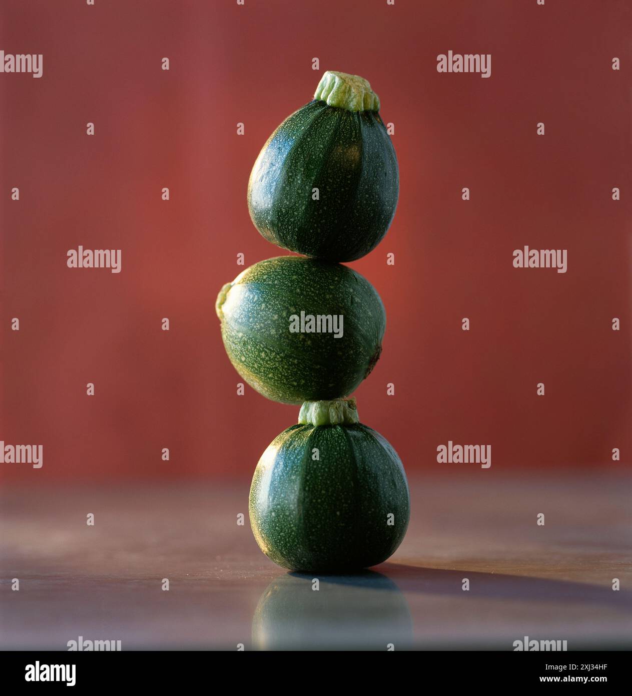 Three round zucchinis Stock Photo - Alamy