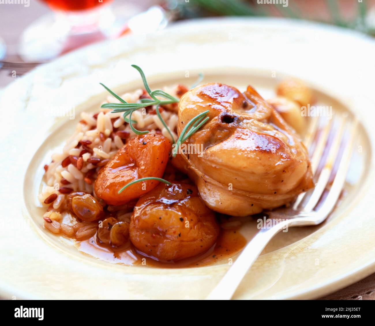 Saddle of rabbit with dried fruit rice Stock Photo - Alamy