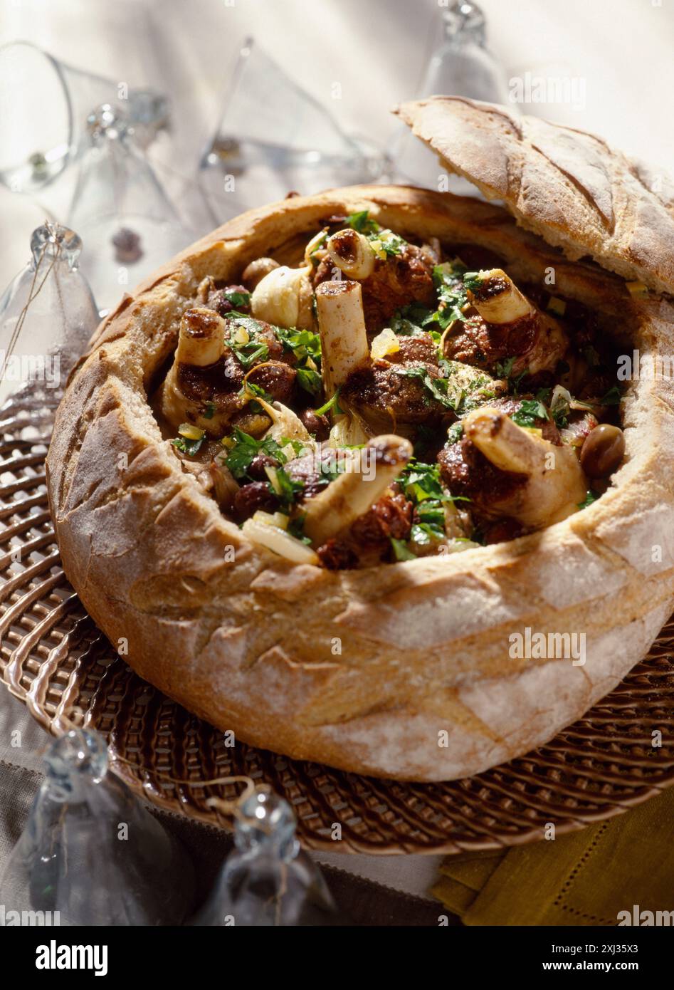 Easter bread nest filled with knuckles of lamb and herbs Stock Photo ...
