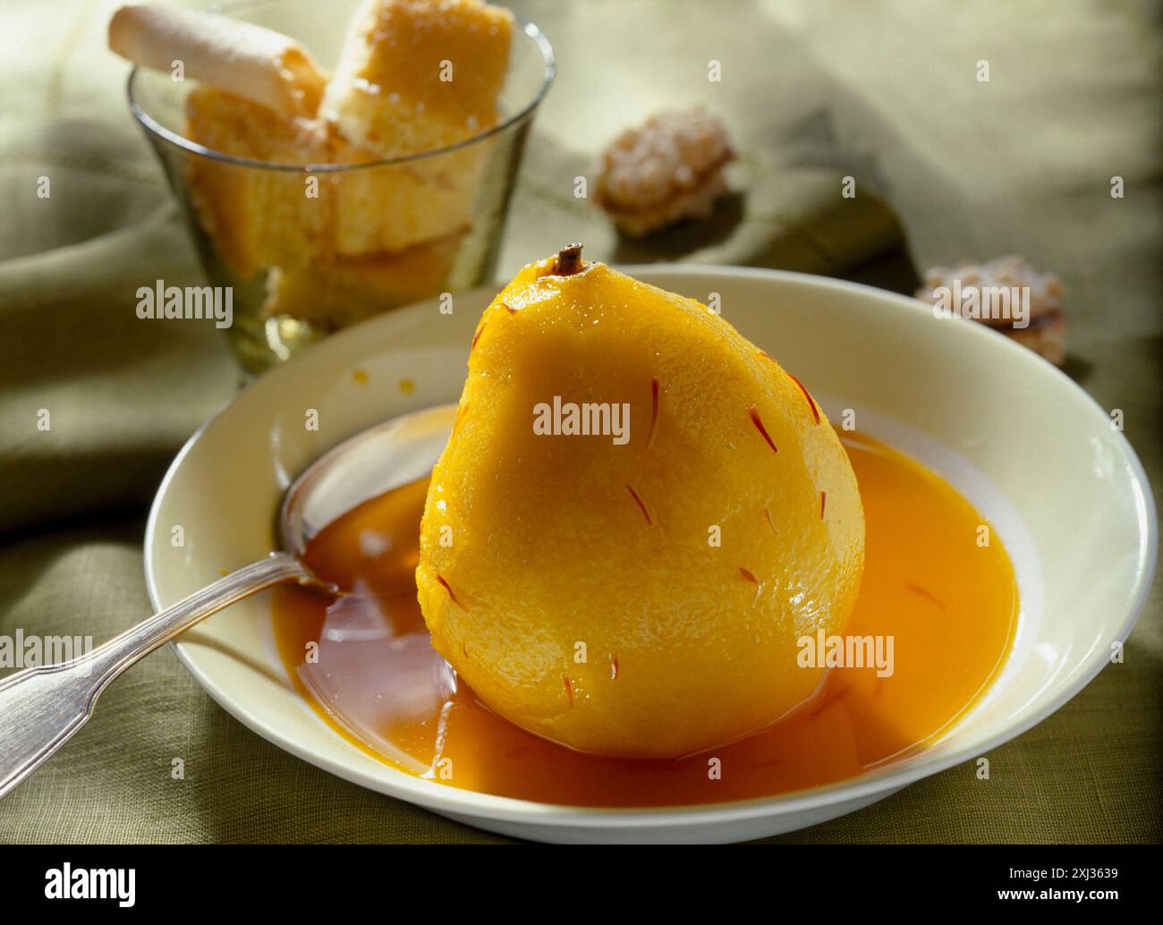 Poached pear with saffron Stock Photo - Alamy
