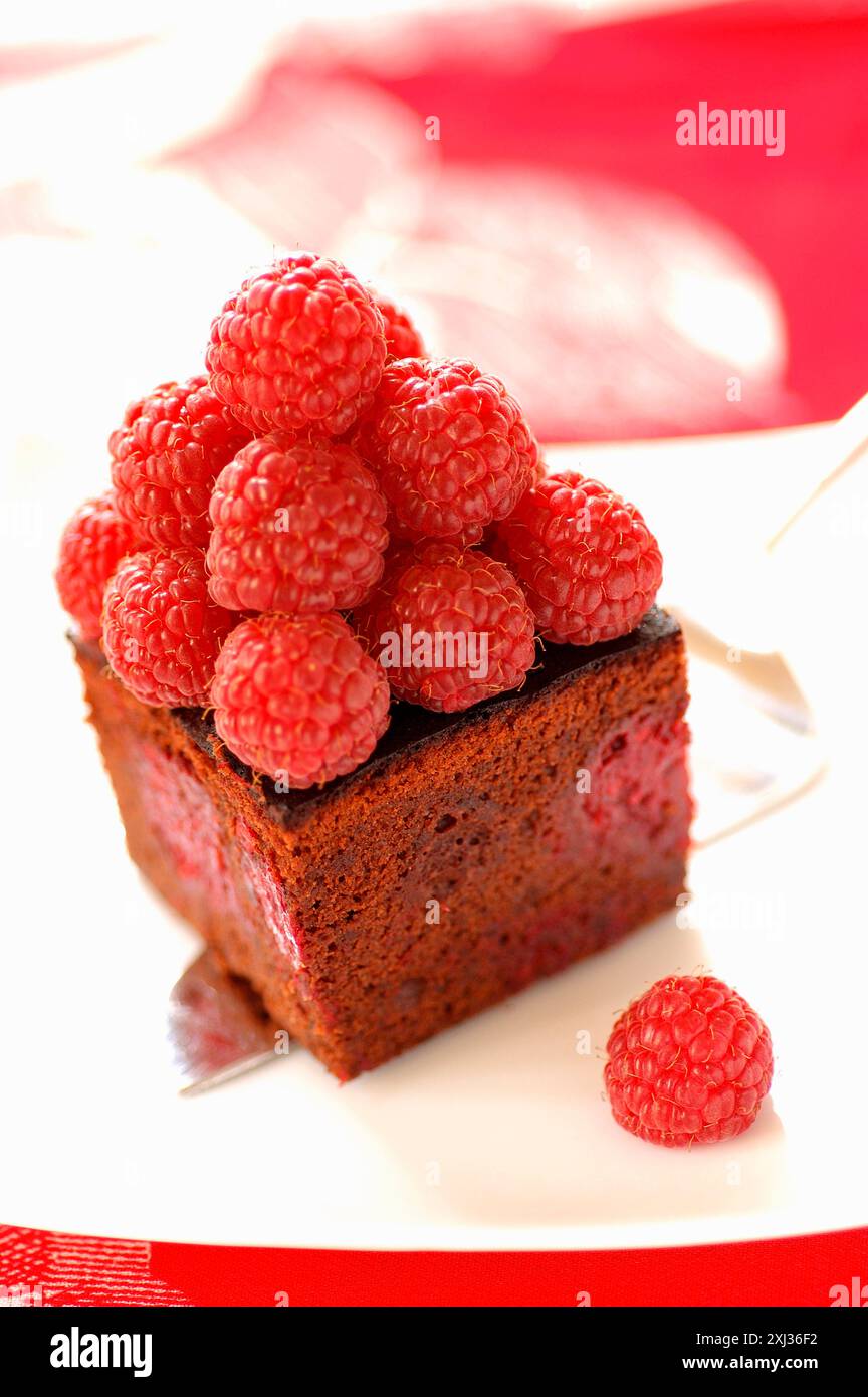 Dark chocolate cake with raspberries (topic: red cooking Stock Photo ...