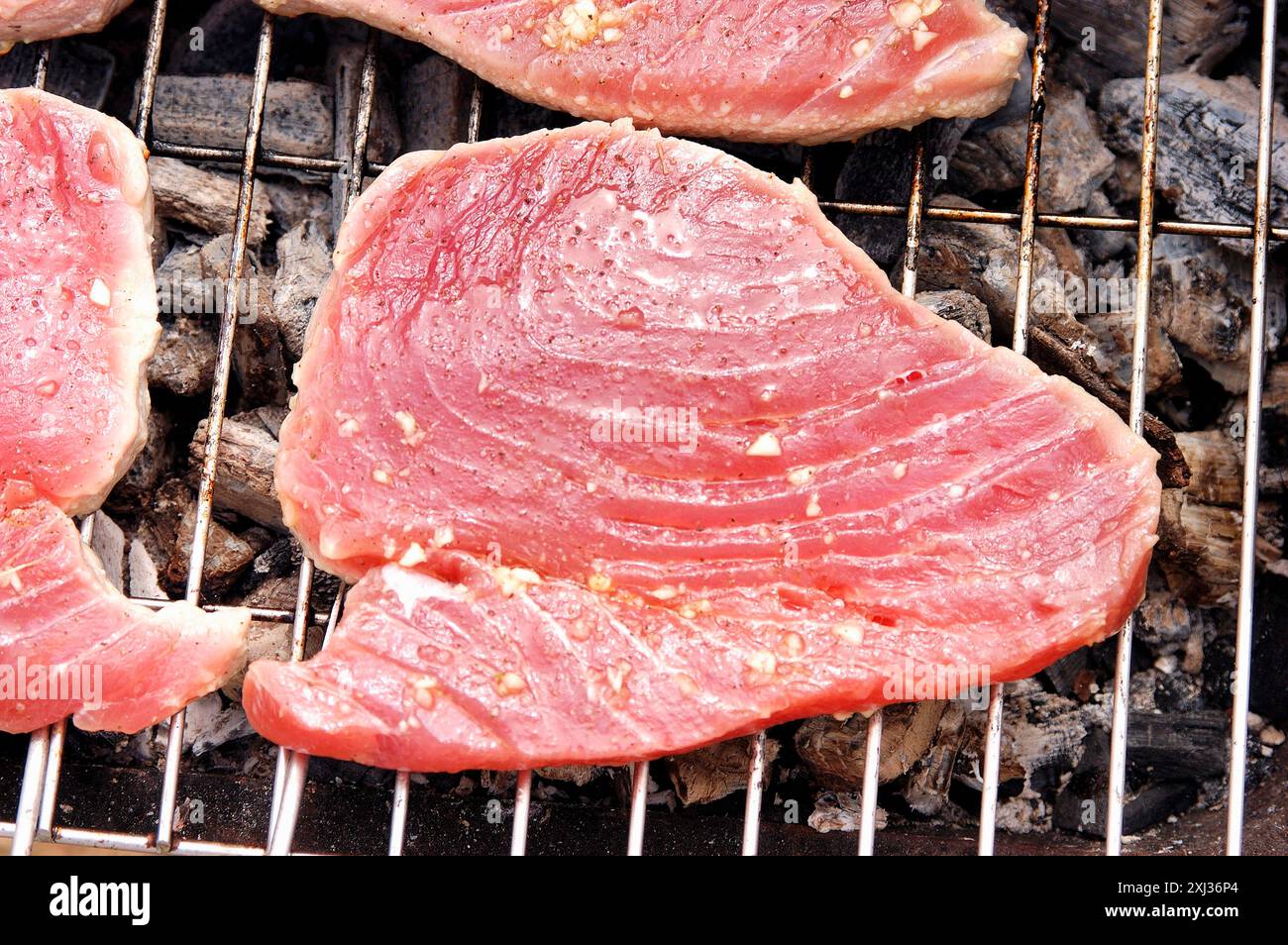 Slices of tuna on the barbecue Stock Photo - Alamy