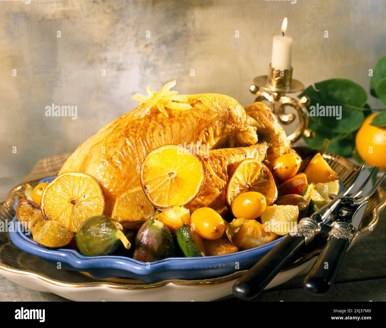Roast capon with citrus fruit and figs Stock Photo - Alamy