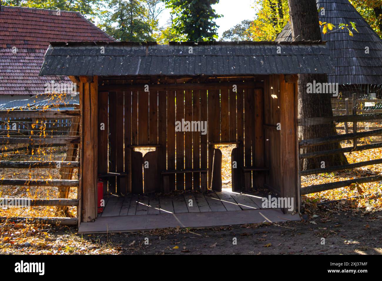 Traditional wooden gate and house at the Dimitrie Gusti Village Museum ...