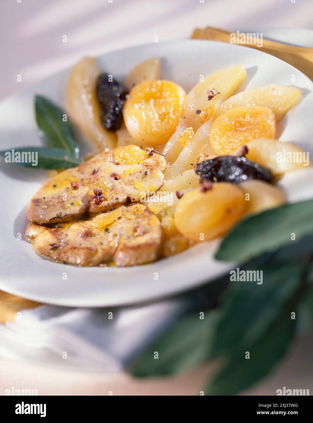 Pan-fried foie gras with pears and dried fruit Stock Photo - Alamy