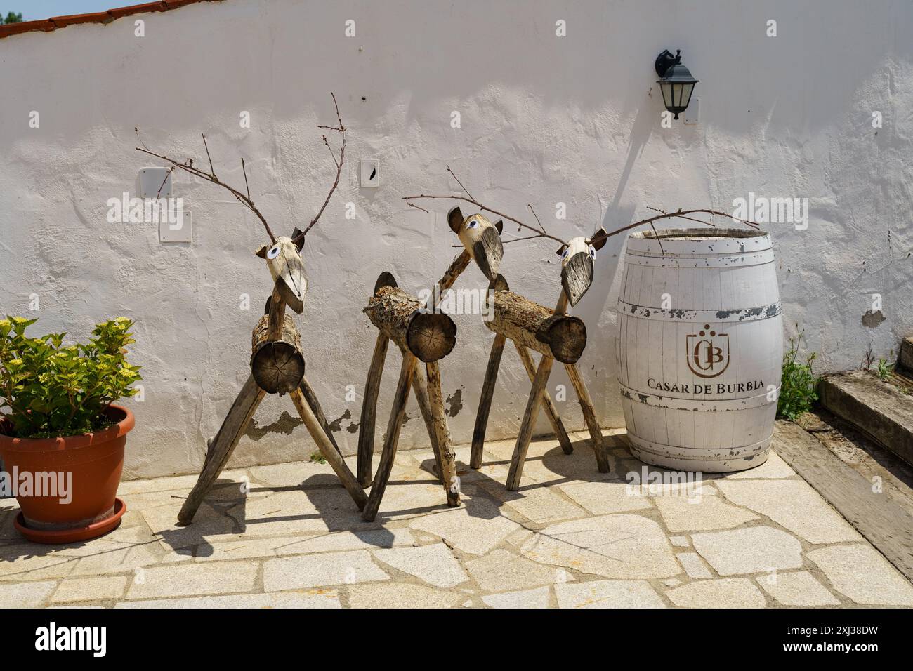 Astorga, Spain - June 4, 2023: Three wooden reindeer sculptures stand ...