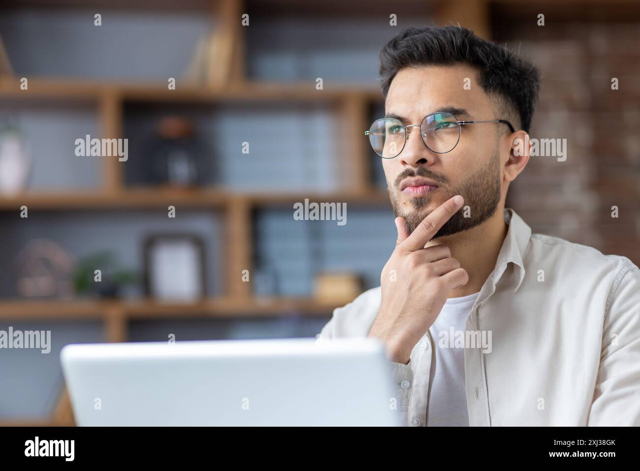 Indian man home studies online hi-res stock photography and images - Alamy