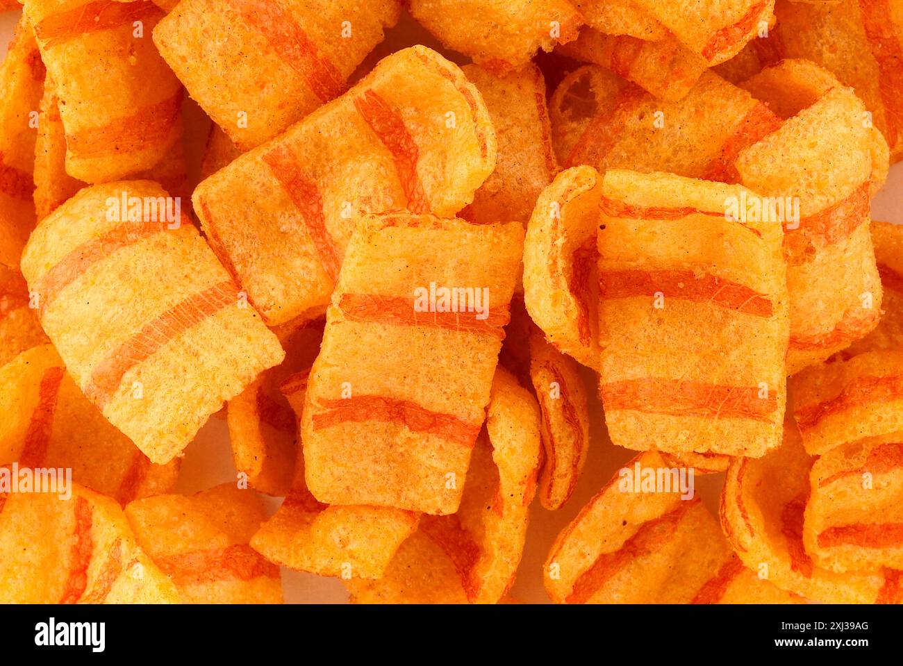 Bacon-flavored aperitif crackers Stock Photo - Alamy