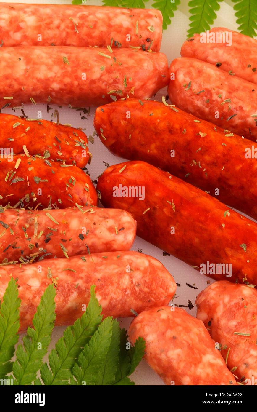 Raw mini sausages for a barbecue Stock Photo - Alamy