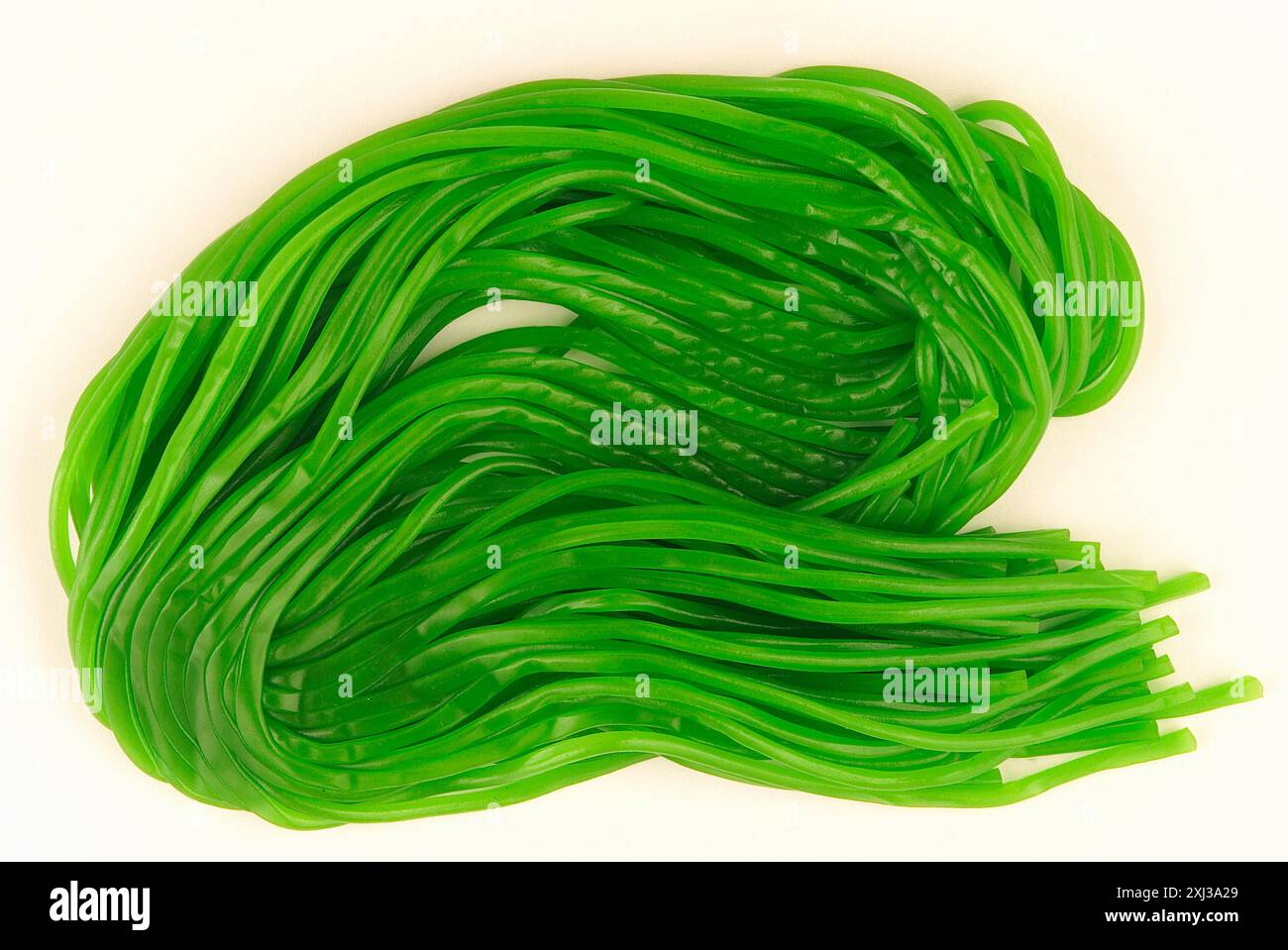 Apple-flavored spaghetti candies Stock Photo - Alamy